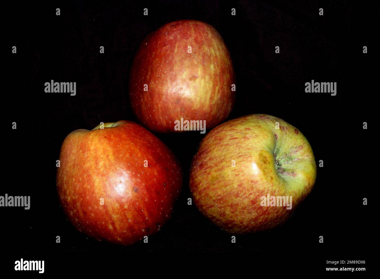 fresh sweet red apple isolated on black background Stock Photo - Alamy