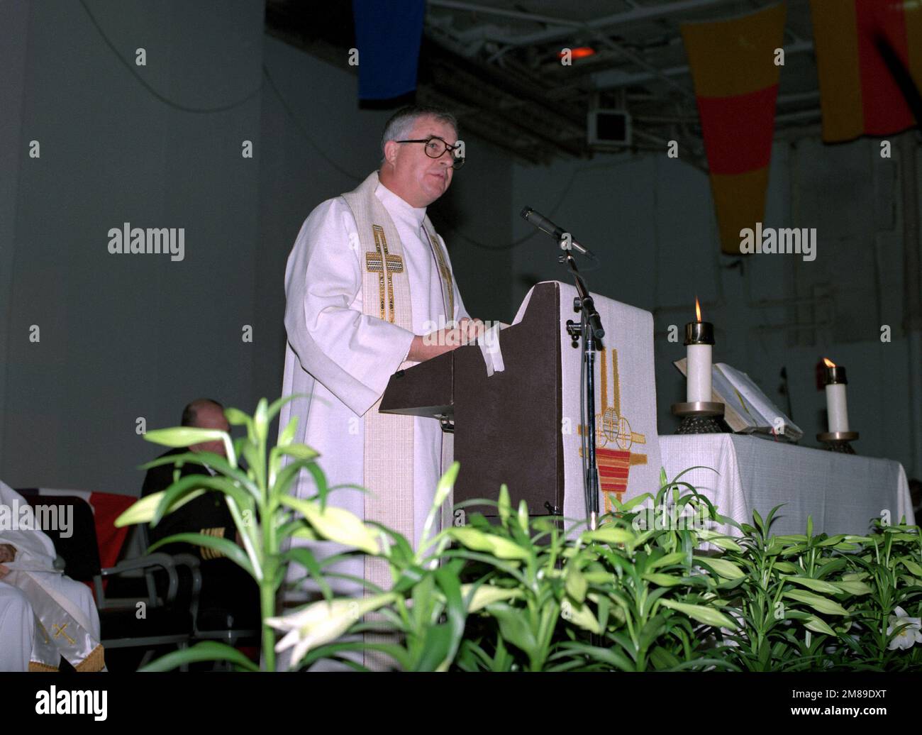 A chaplain delivers a sermon during an interfaith Easter morning ...