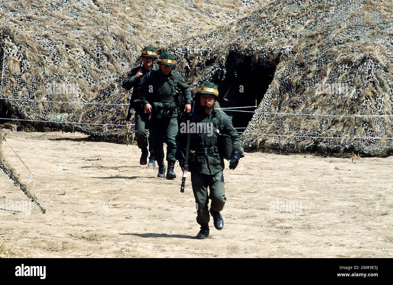 South Korean soldiers exit a camouflaged tent during Exercise Team ...