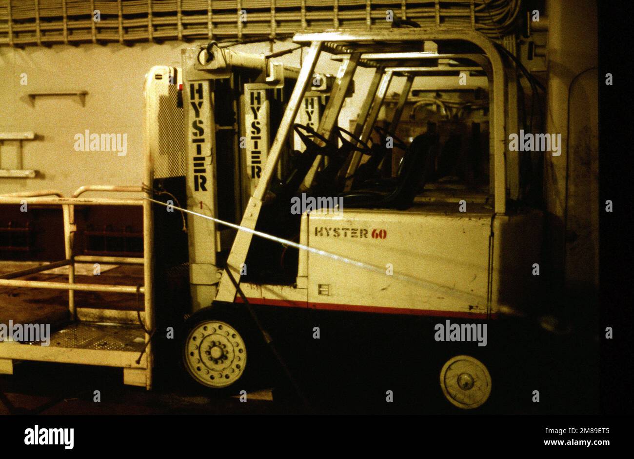 Forklifts are parked in the cargo hold of the maritime pre-positioning ...