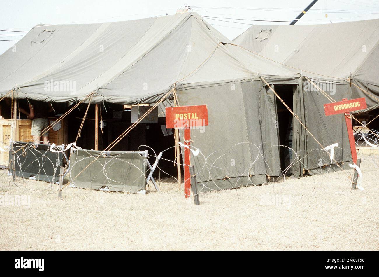 A view of a tent used as a postal and disbursing facility during ...