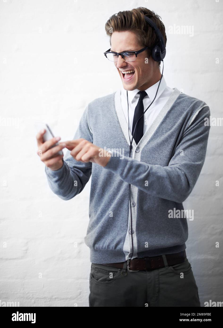 Good song are what its all about. A very excited young man smiling at ...