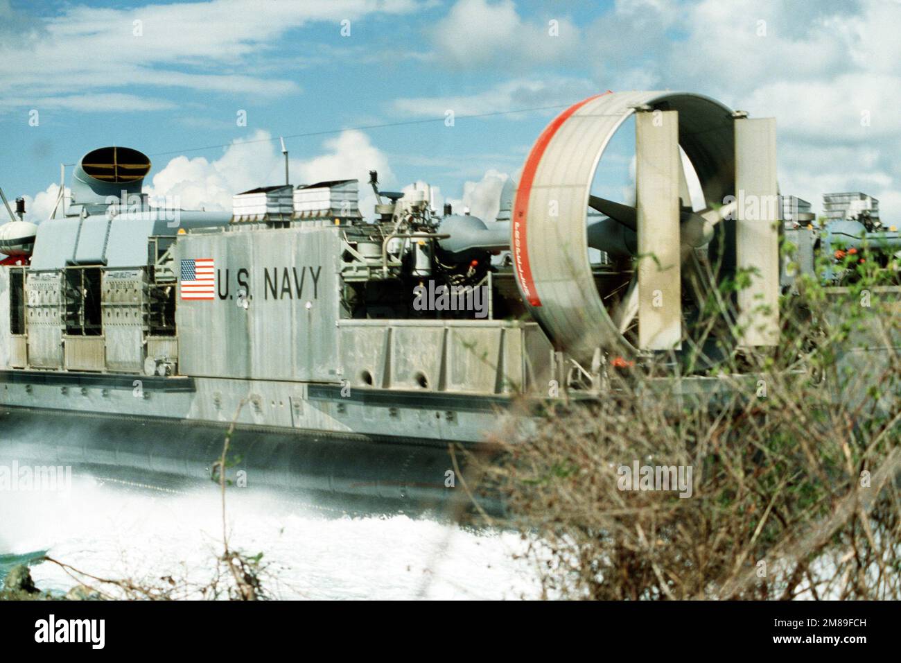 The air cushion landing craft LCAC-7 leaves the beach during exercise ...