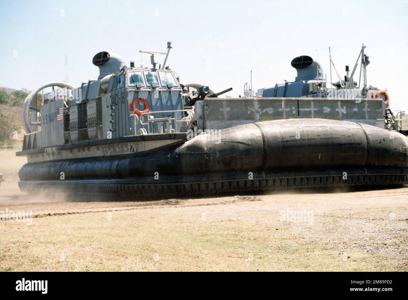 The air cushion landing craft LCAC-8 moves across the beach during ...