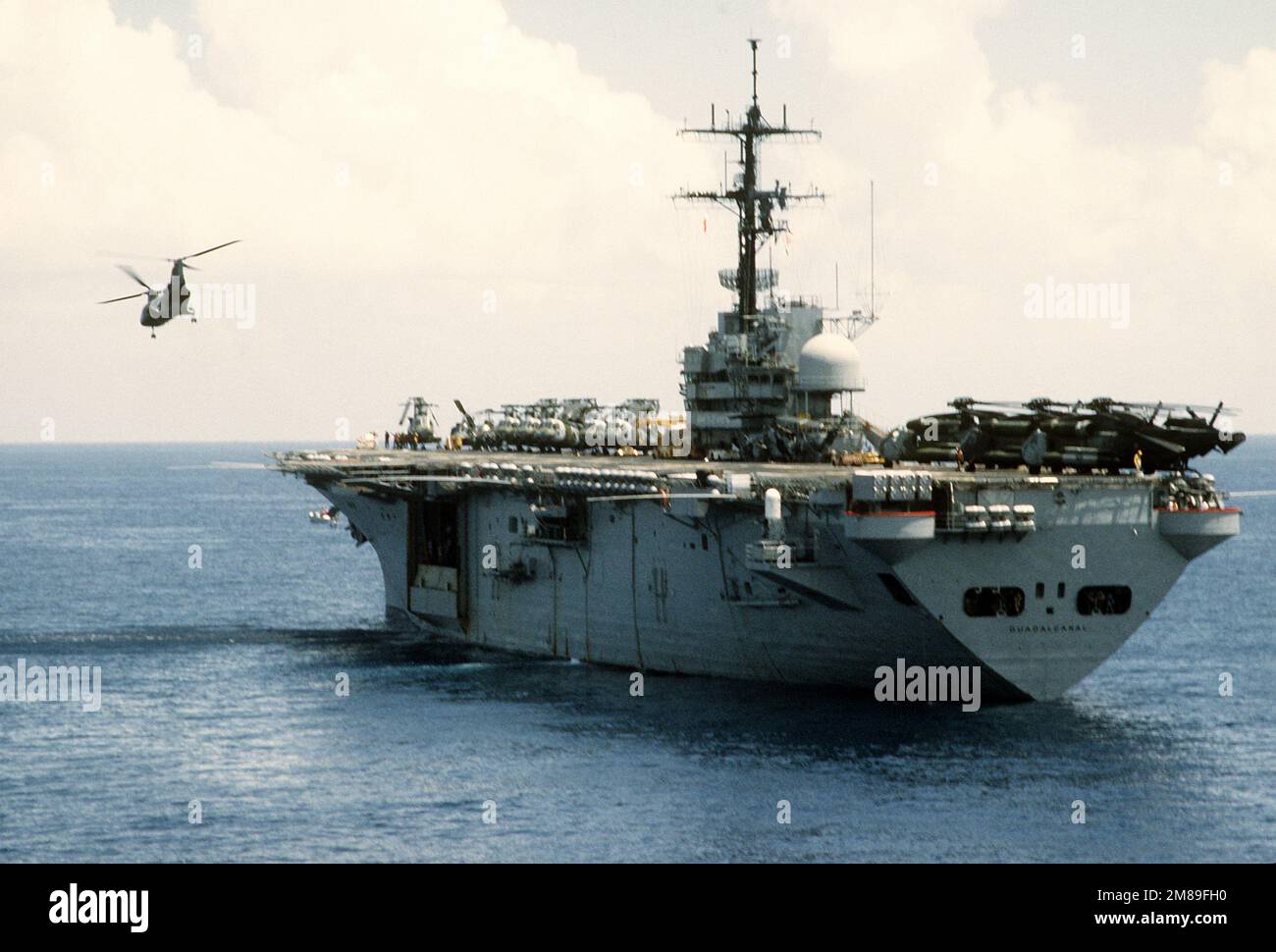 A port quarter view of the amphibious assault ship USS GUADALCANAL (LPH ...