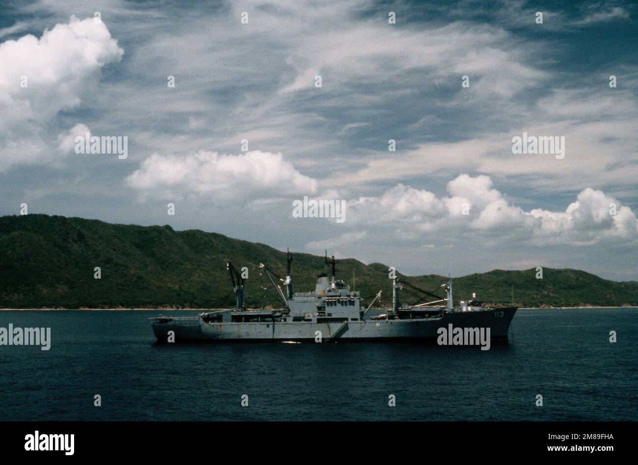 A starboard beam view of the amphibious cargo ship USS CHARLESTON (LKA ...