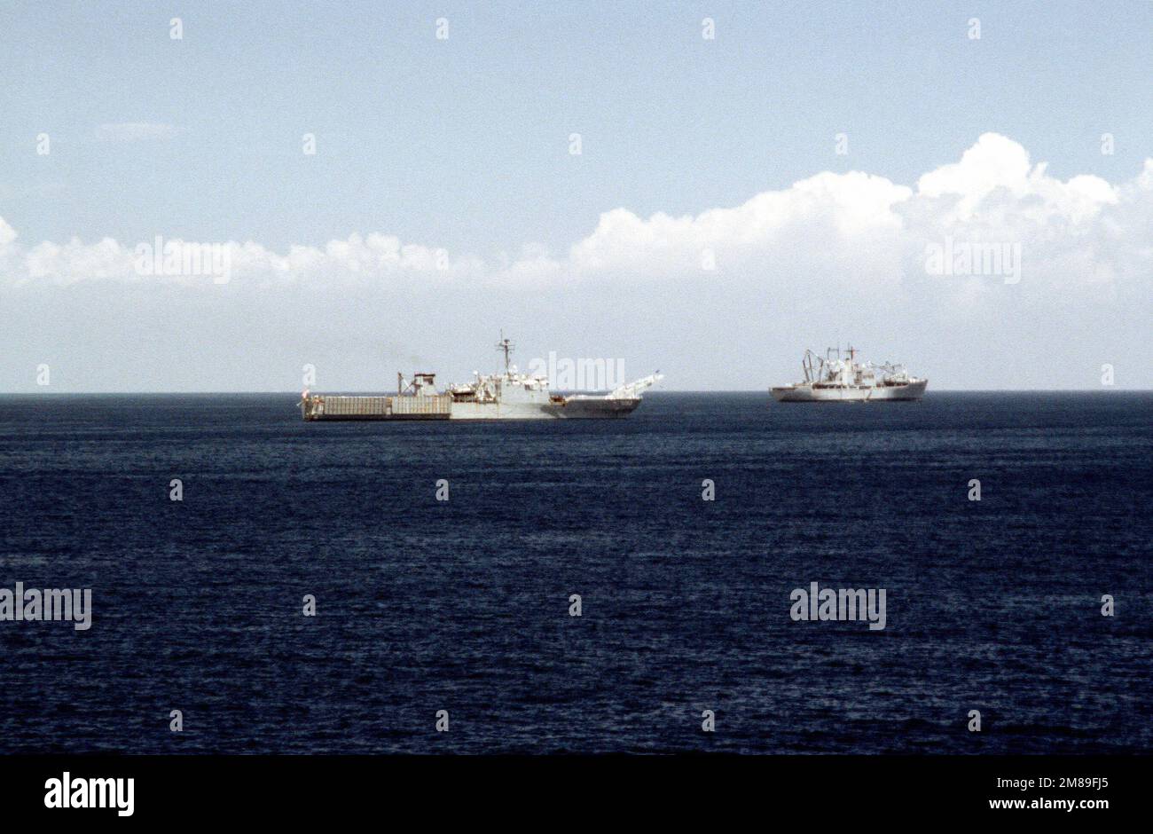 The tank landing ship USS BOULDER (LST 1190), center, and the ...