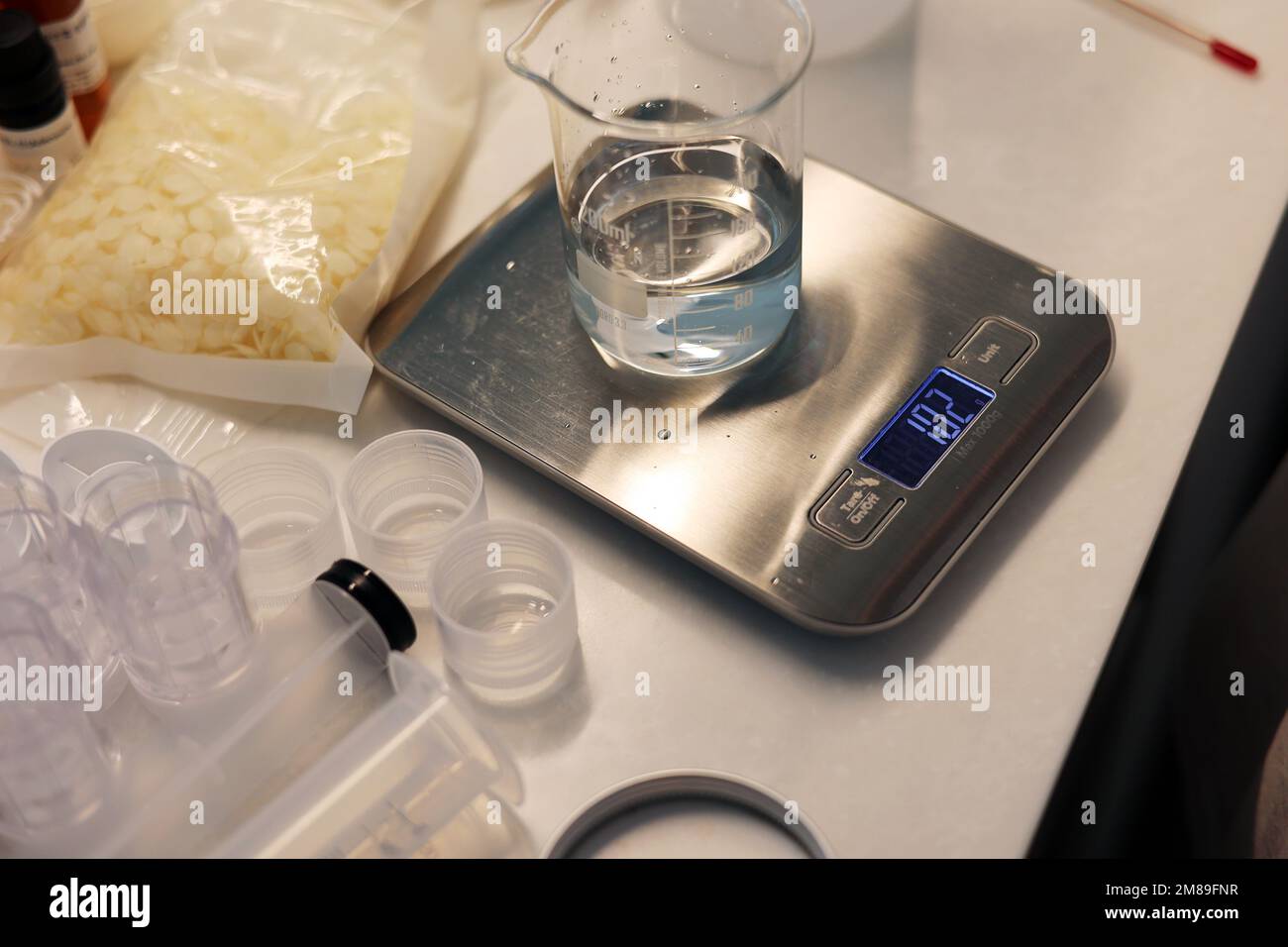 Weigh water in the beaker on the electronic scale in the laboratory ...