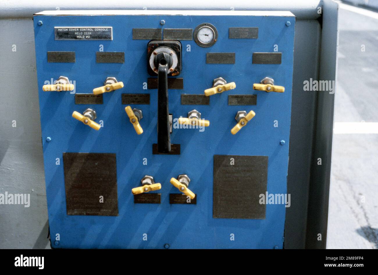 A view of a hatch cover control panel aboard the aviation logistic ship ...