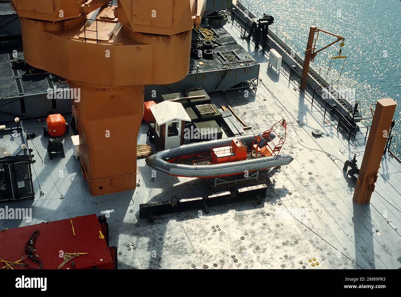 A view of a section of deck forward of the superstructure aboard the ...
