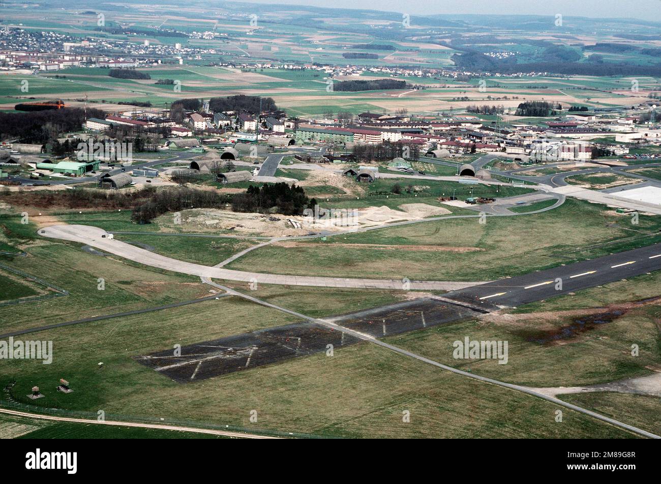 An aerial view of the aircraft shelters and other facilities aboard the ...