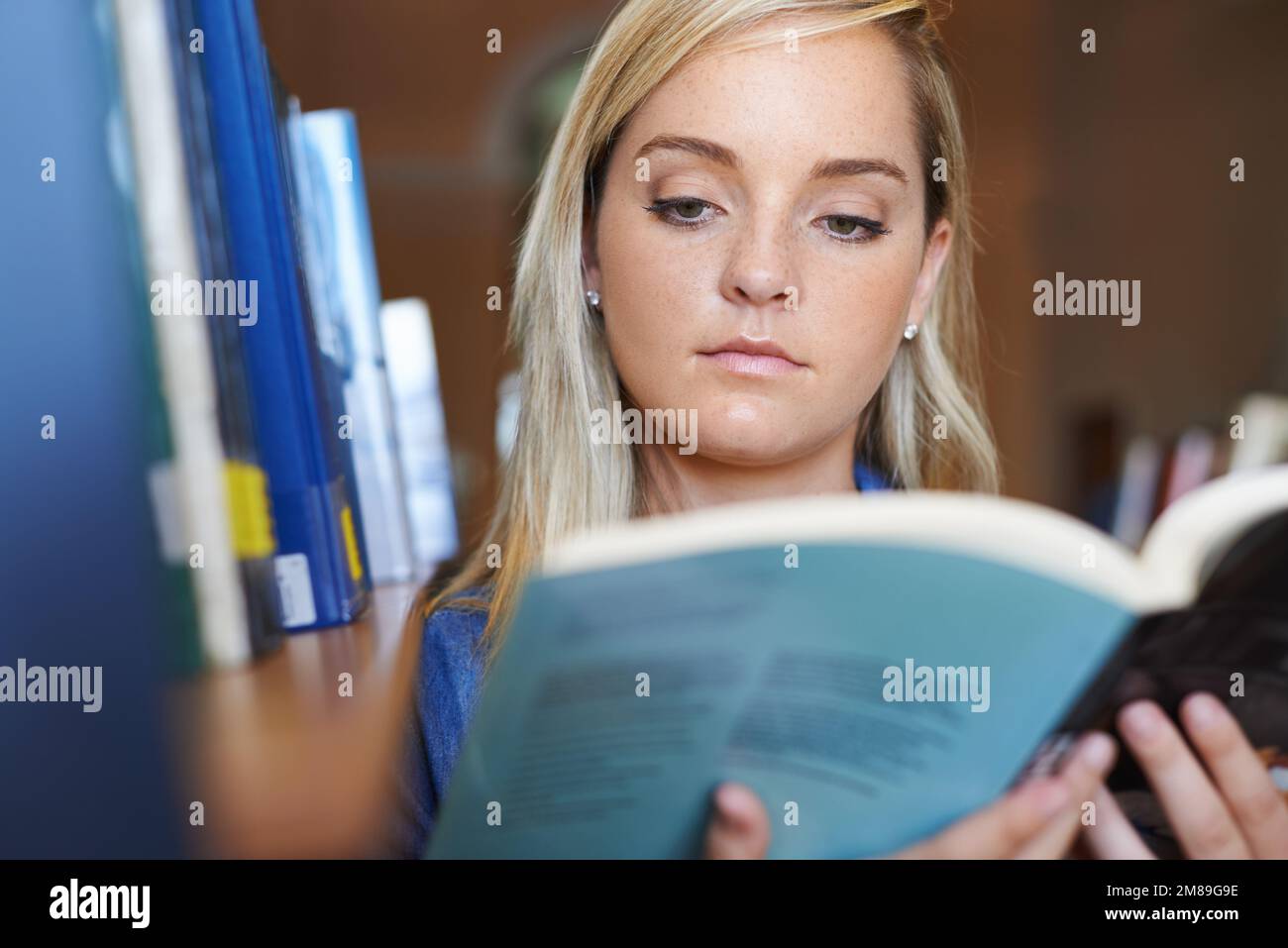 Our university has the best library. an attractive young student ...