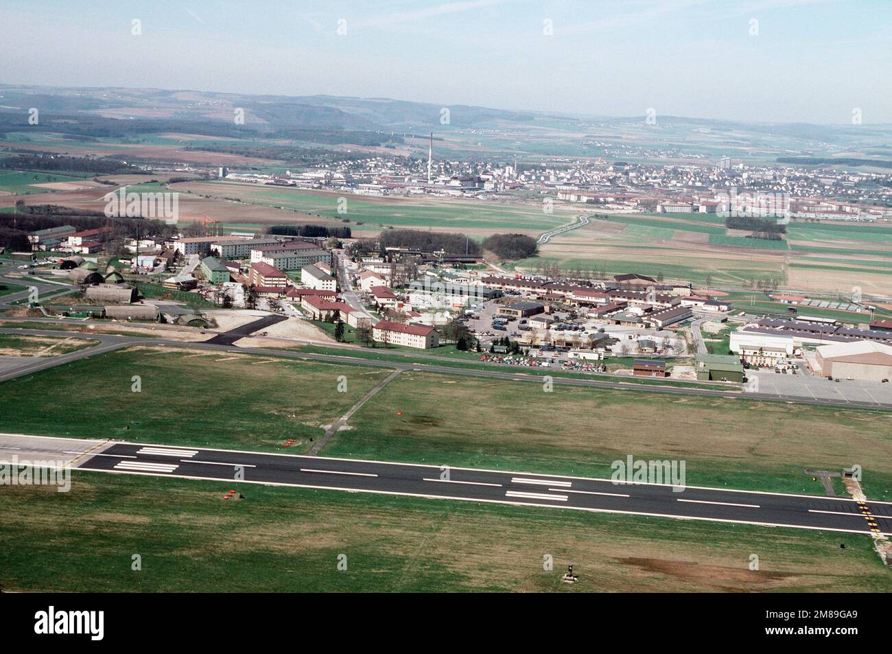 An aerial view of a portion of the runway and facilities on the base ...