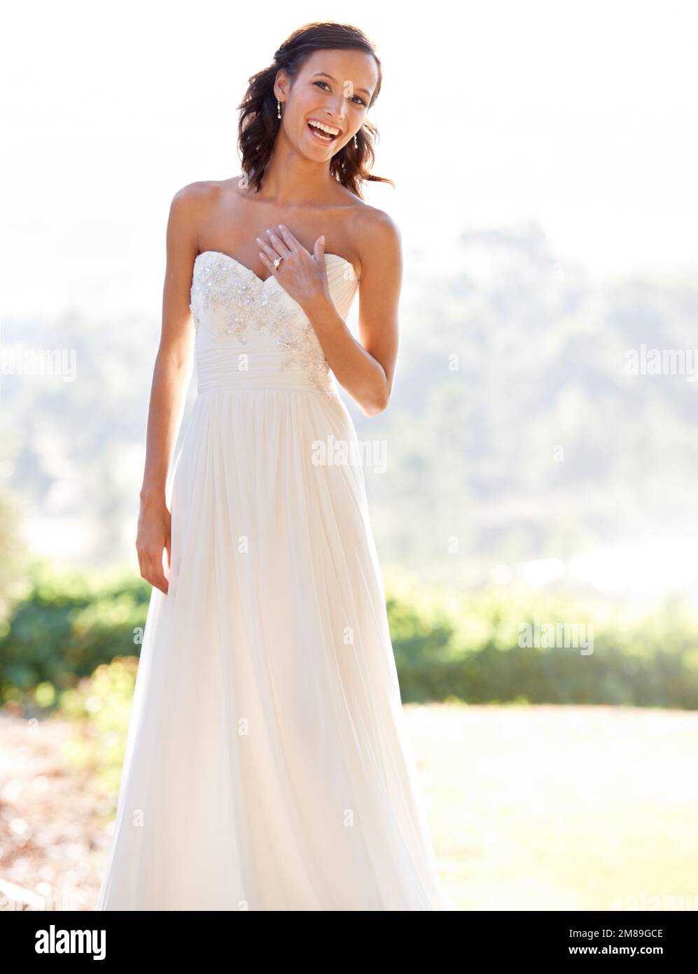 Happiness in its purest form. A beautiful young bride laughing while ...