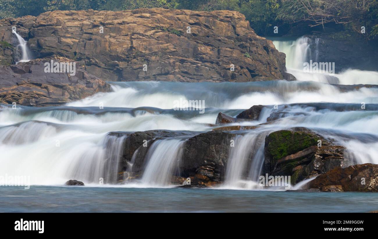Long exposure photo of smooth waterfall flowing through steps Stock ...