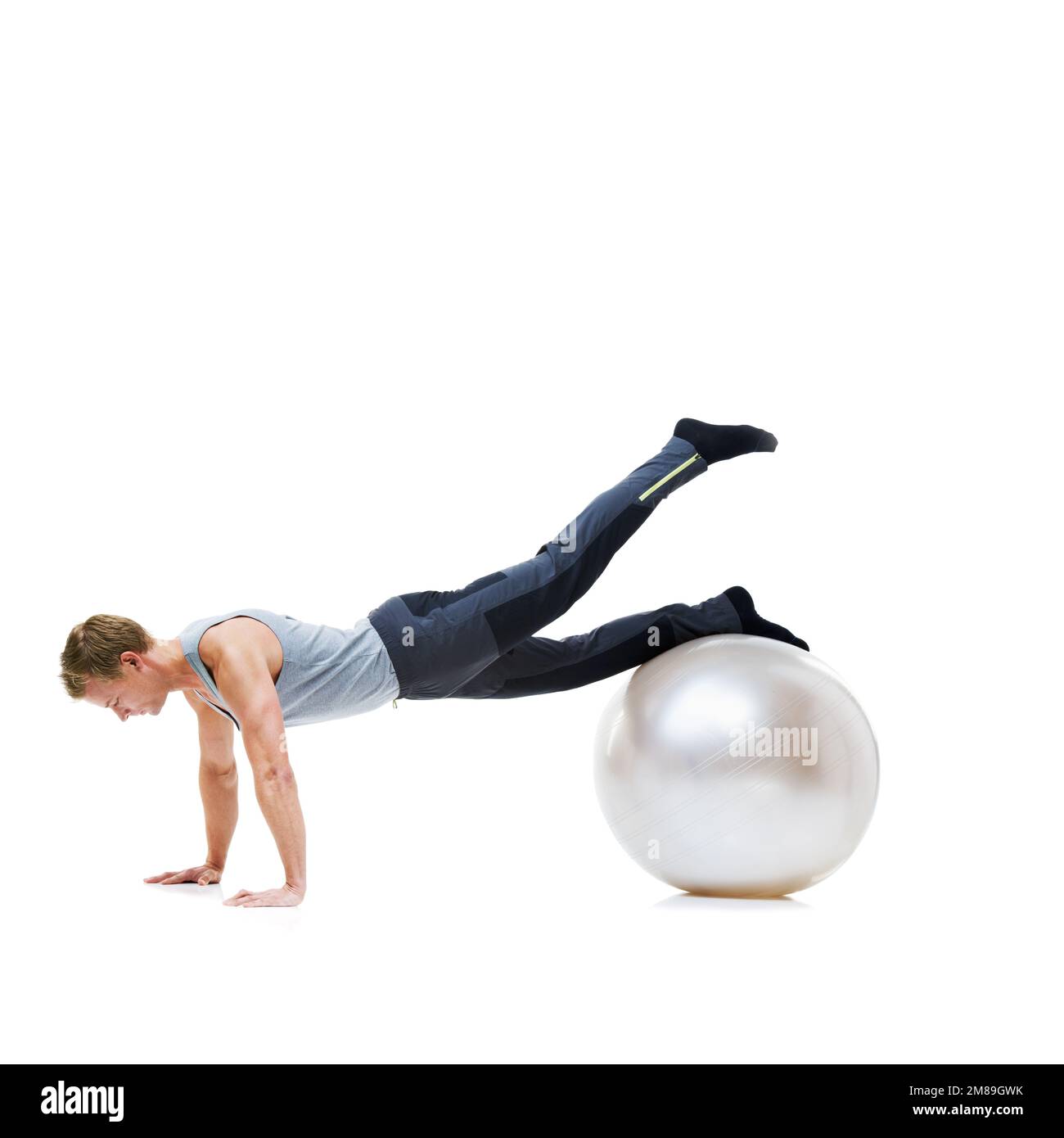 The exercise ball helps with my balance technique. a man balancing on ...