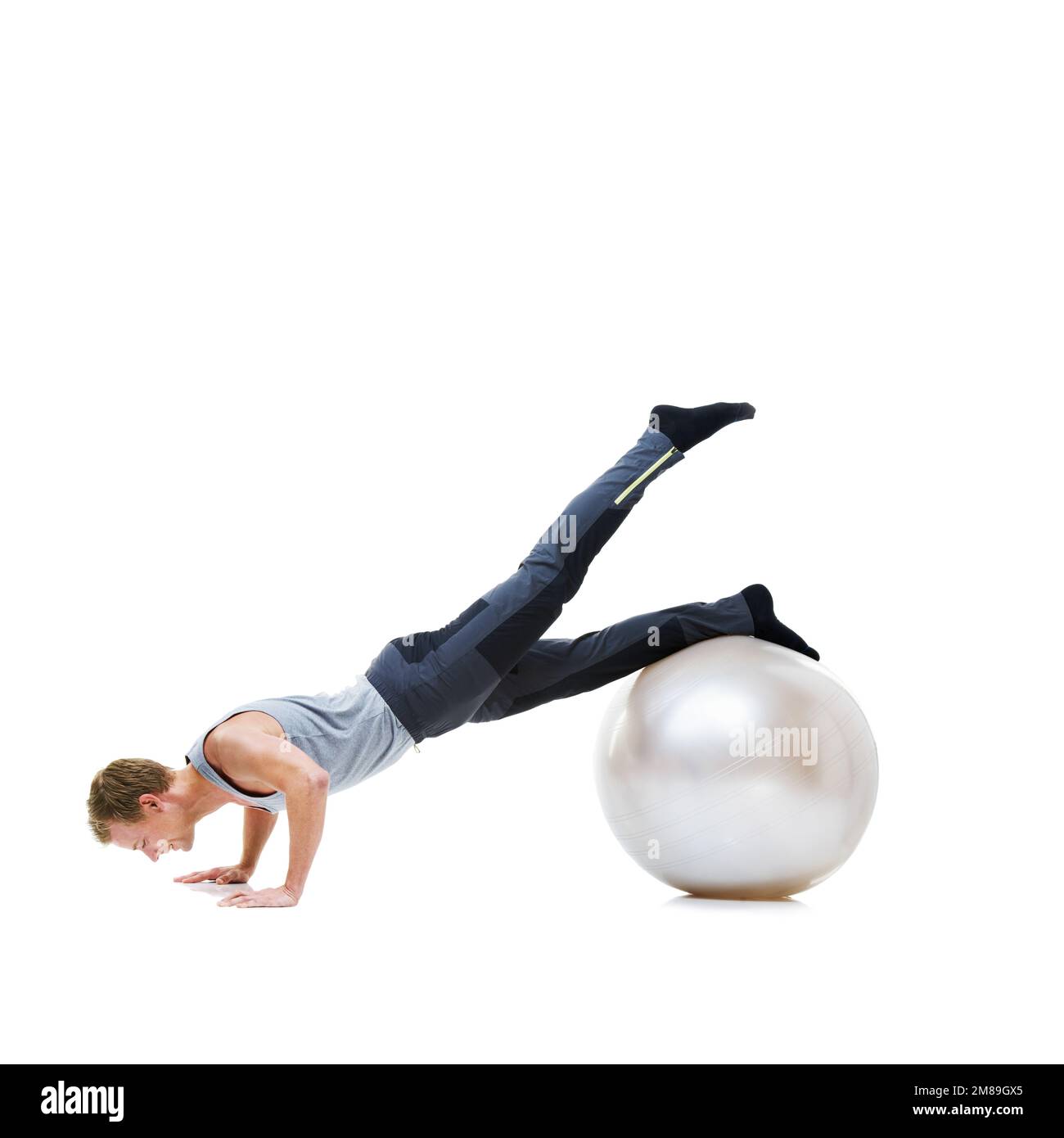 Hes got perfect balance. a man balancing on an exercise ball with a ...