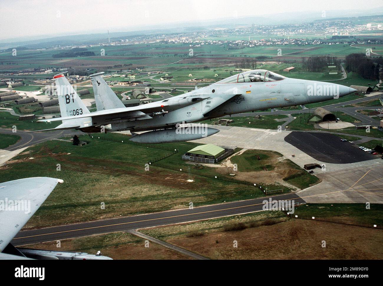 An air-to-air right side view of an F-15 Eagle aircraft from the 22nd ...