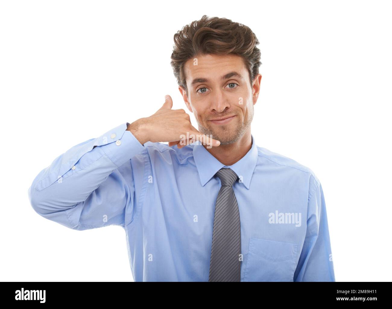 Im always reachable. Studio portrait of a young businessman making a ...