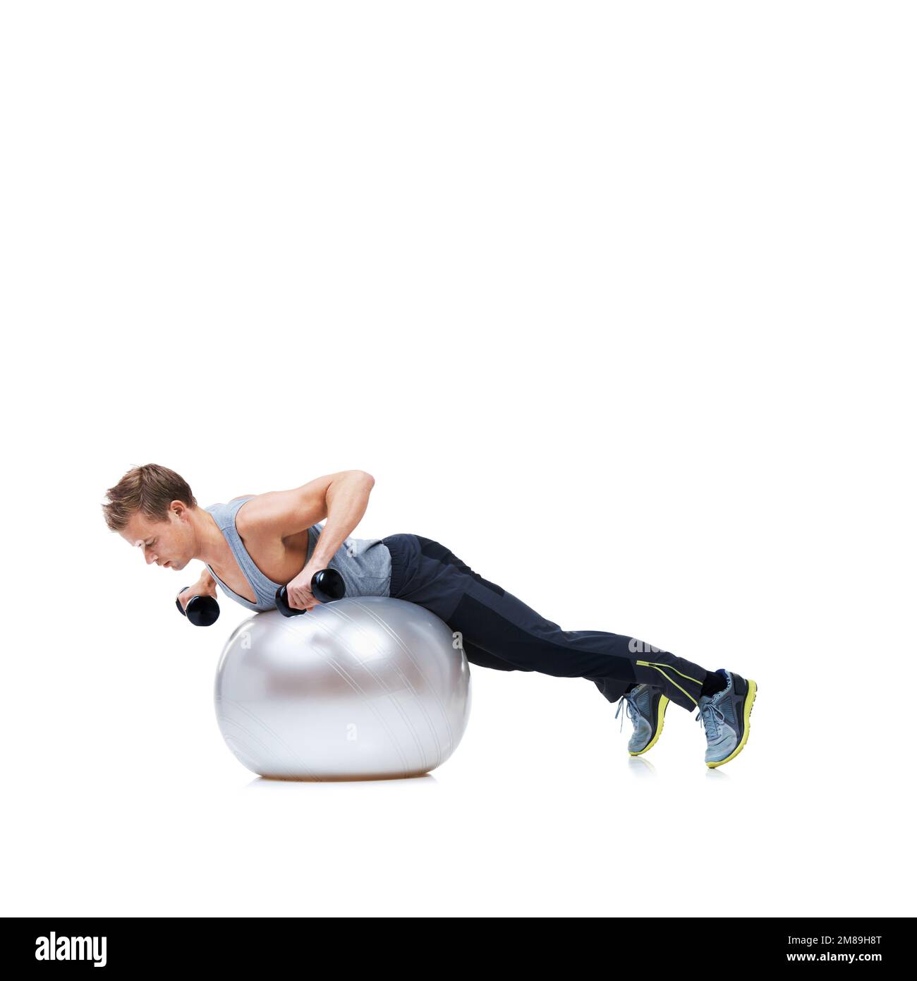 Working out without risking his back. a man balancing on an exercise ...