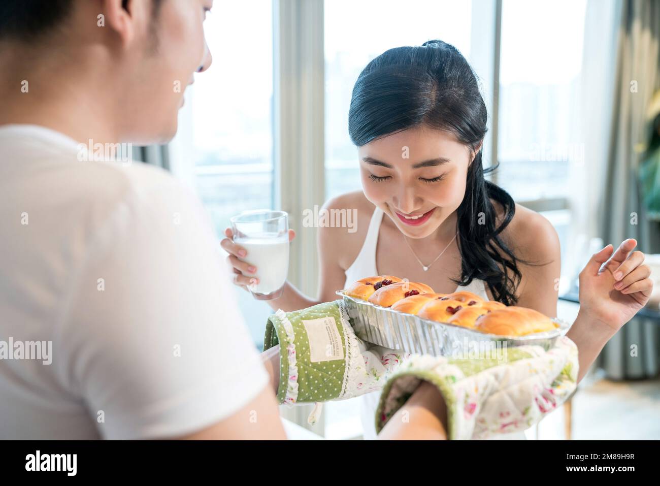 Young lovers baking bread in the kitchen Stock Photo - Alamy