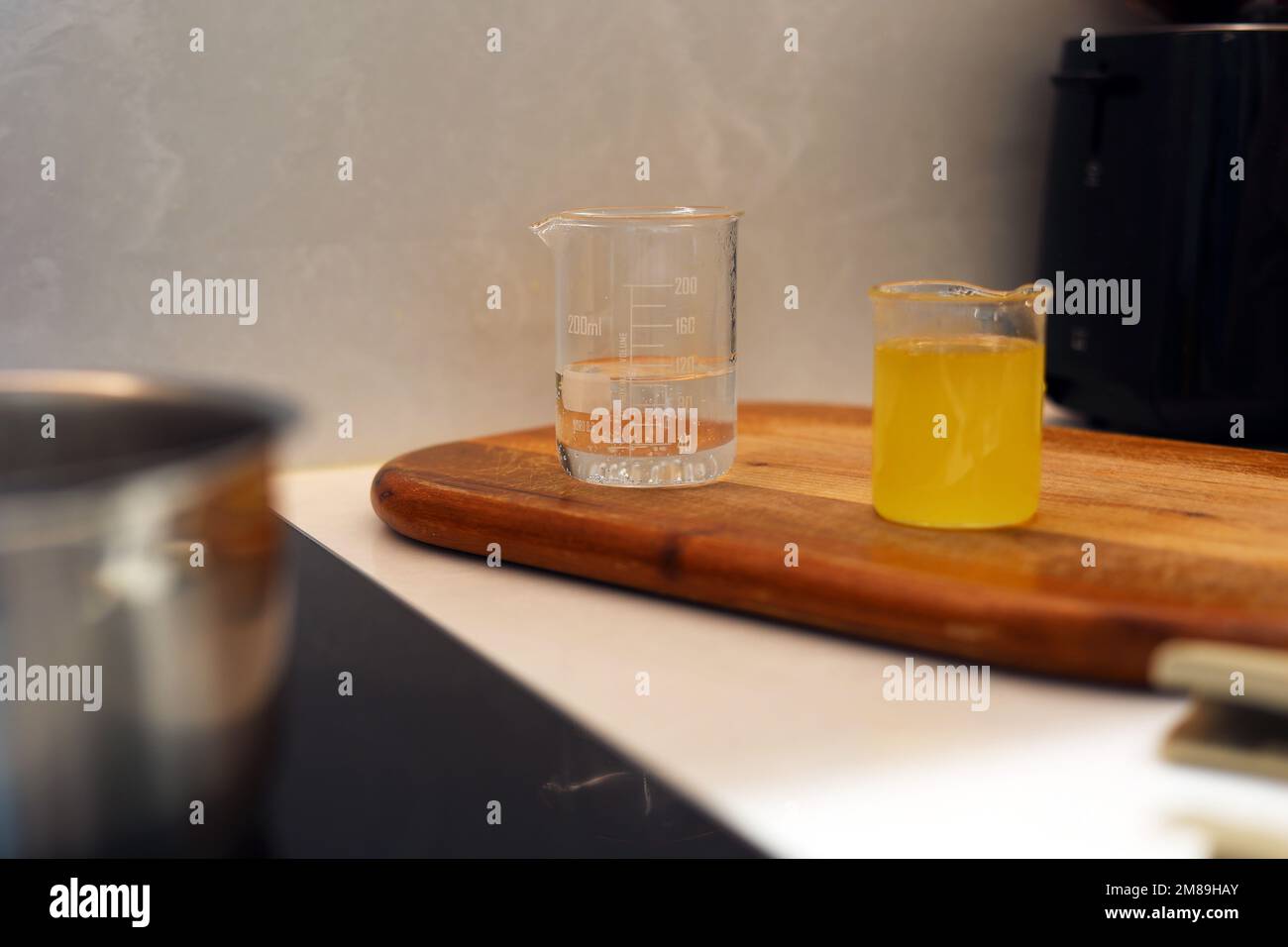 The beakers of water and jojoba oil in the laboratory Stock Photo - Alamy