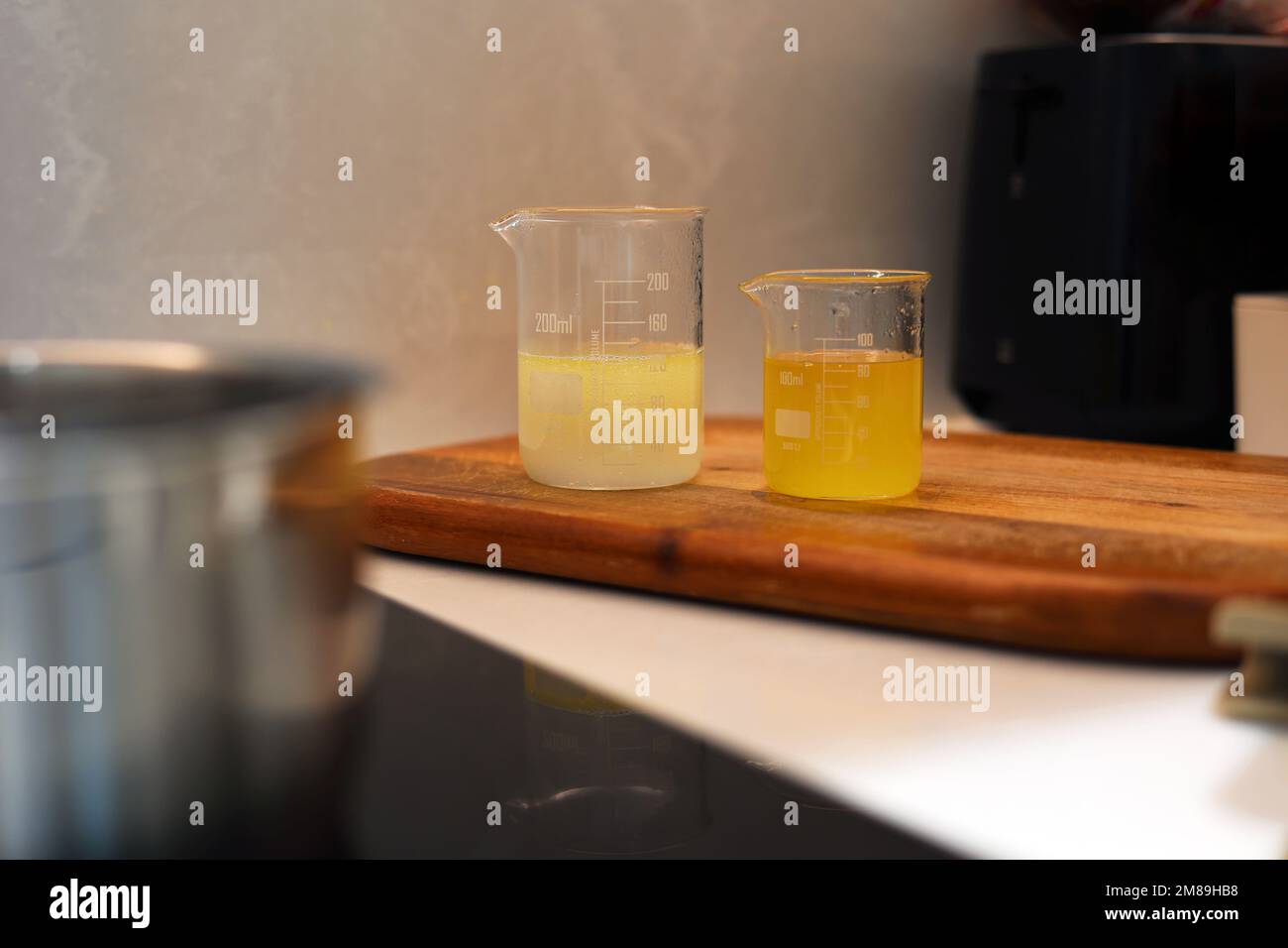 The beakers of water and jojoba oil in the laboratory Stock Photo - Alamy