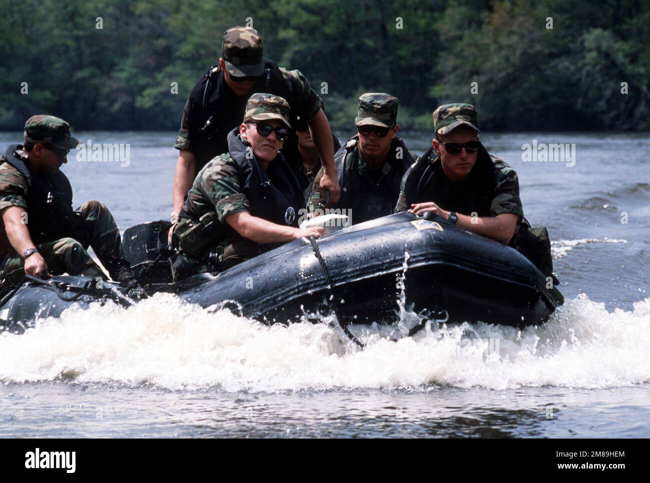 Trainees take their rubber raft up the Yellow River during the water ...