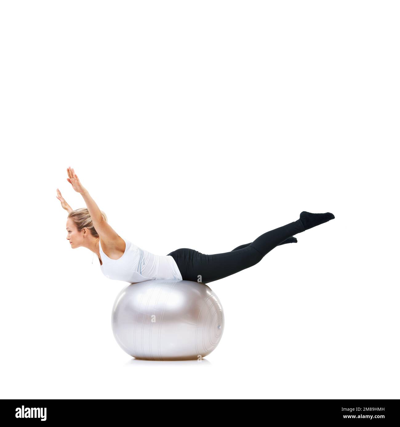 Perfect balance and stability. a woman balancing on an exercise ball ...