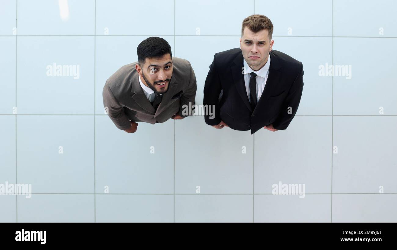 Portrait of two concentrated businessmen partners dressed in formal ...