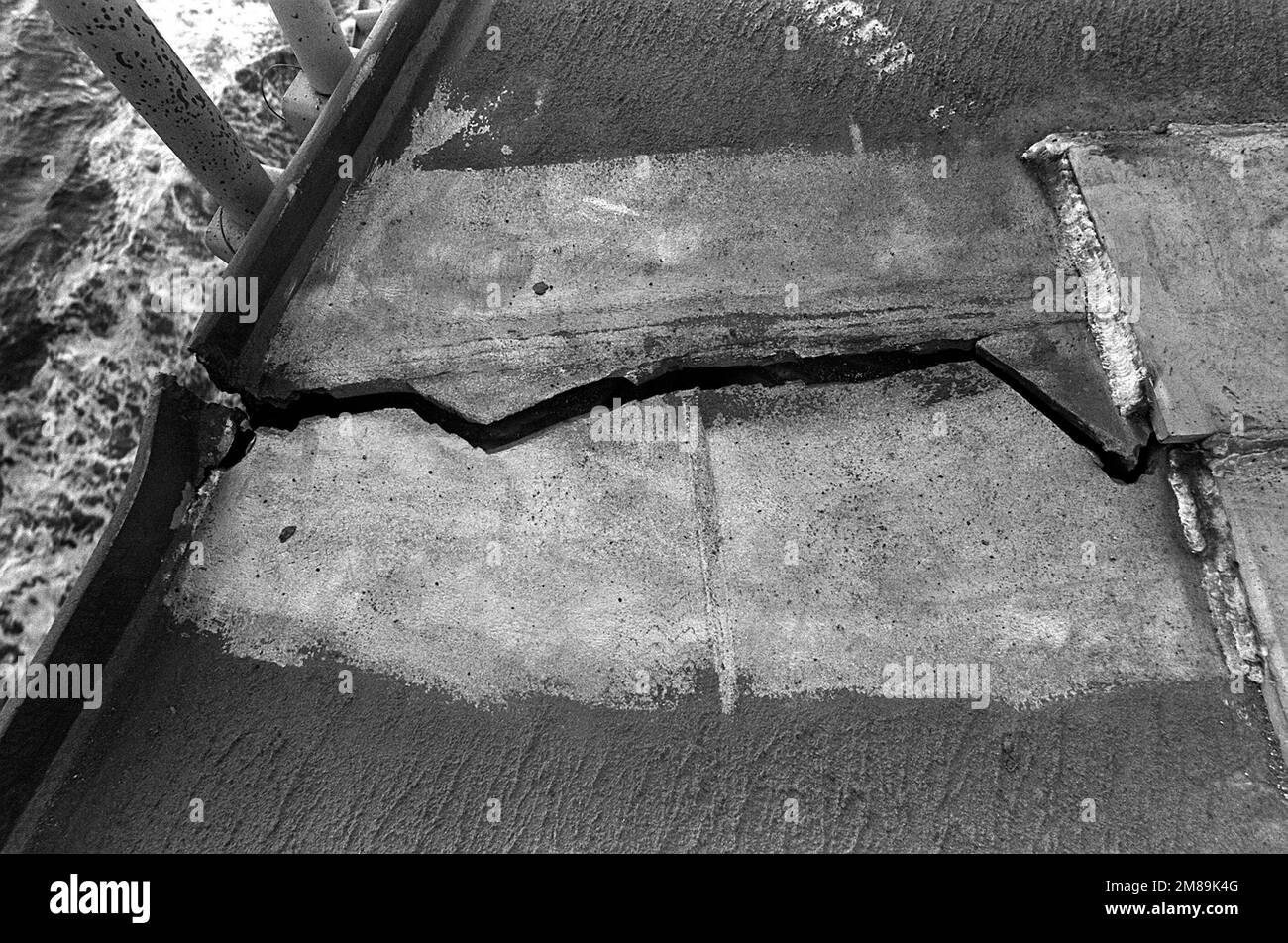 A close-up view of a crack in the starboard weather deck of the guided ...
