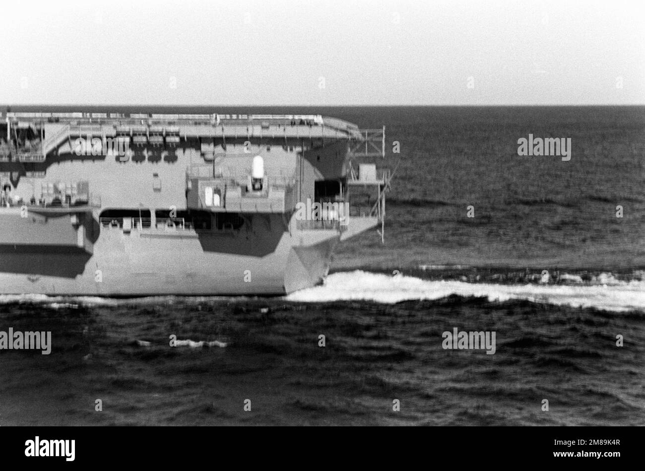 A port view of the stern section of the aircraft carrier USS ...