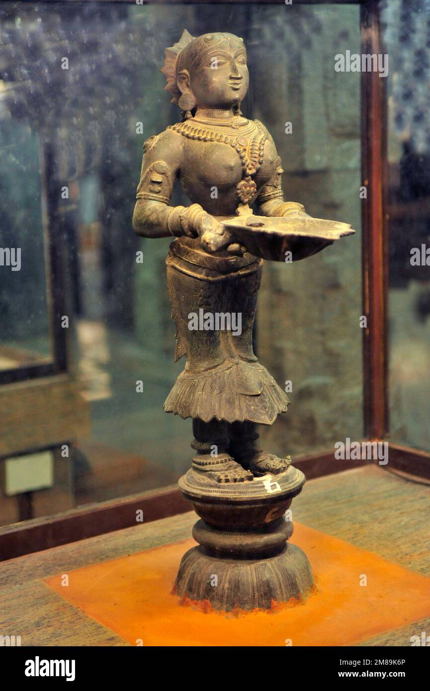 Sculpture of a Woman with lamp in bronze Chola dynasty in Meenakshi ...