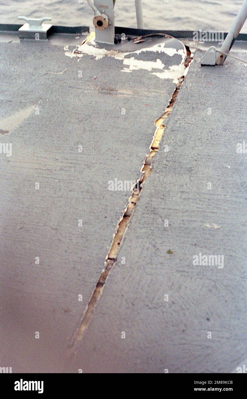 A close-up view of a crack in the deck of the guided missile frigate ...