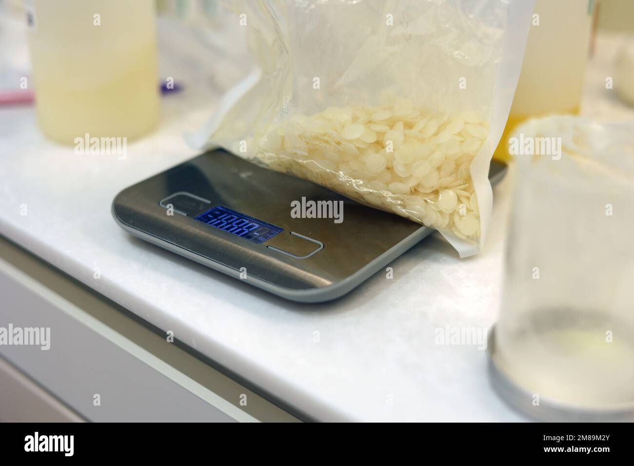 Weigh the beeswax pouch on electronic scale in the laboratory Stock ...