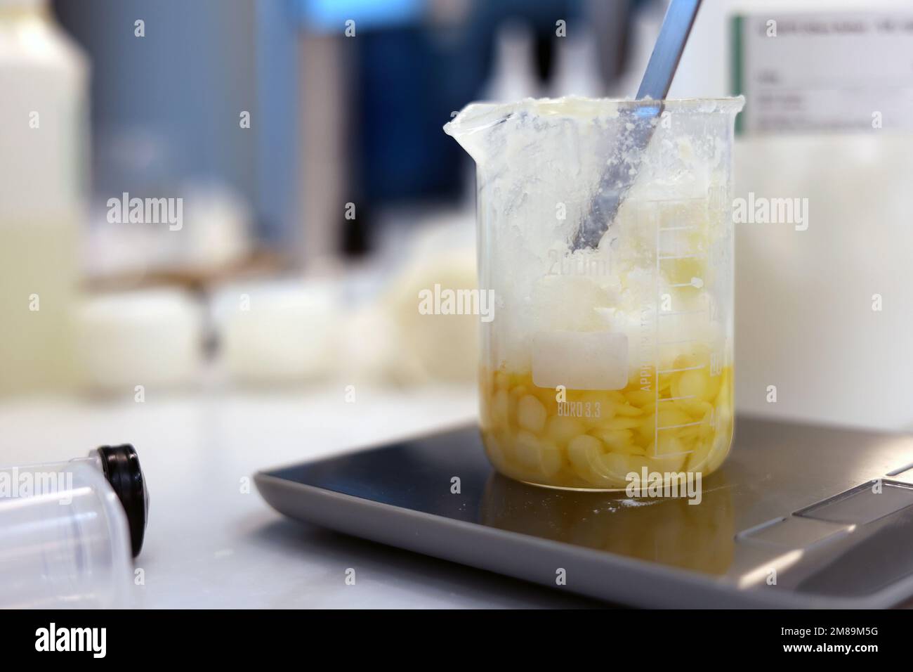 Mix and weigh beeswax ingredients in the beaker on the electronic scale ...
