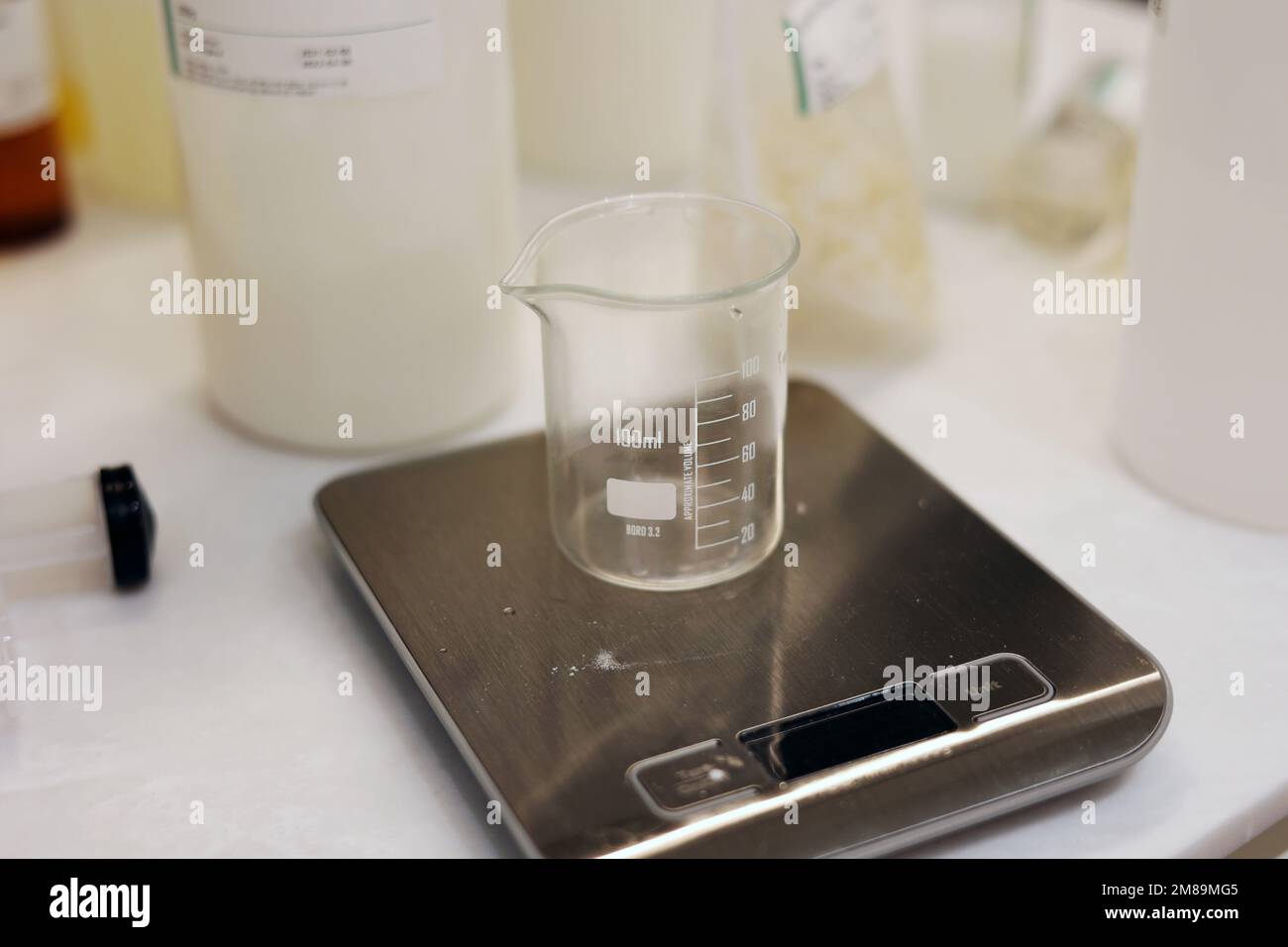 Empty beaker on the electronic scale in the laboratory Stock Photo - Alamy
