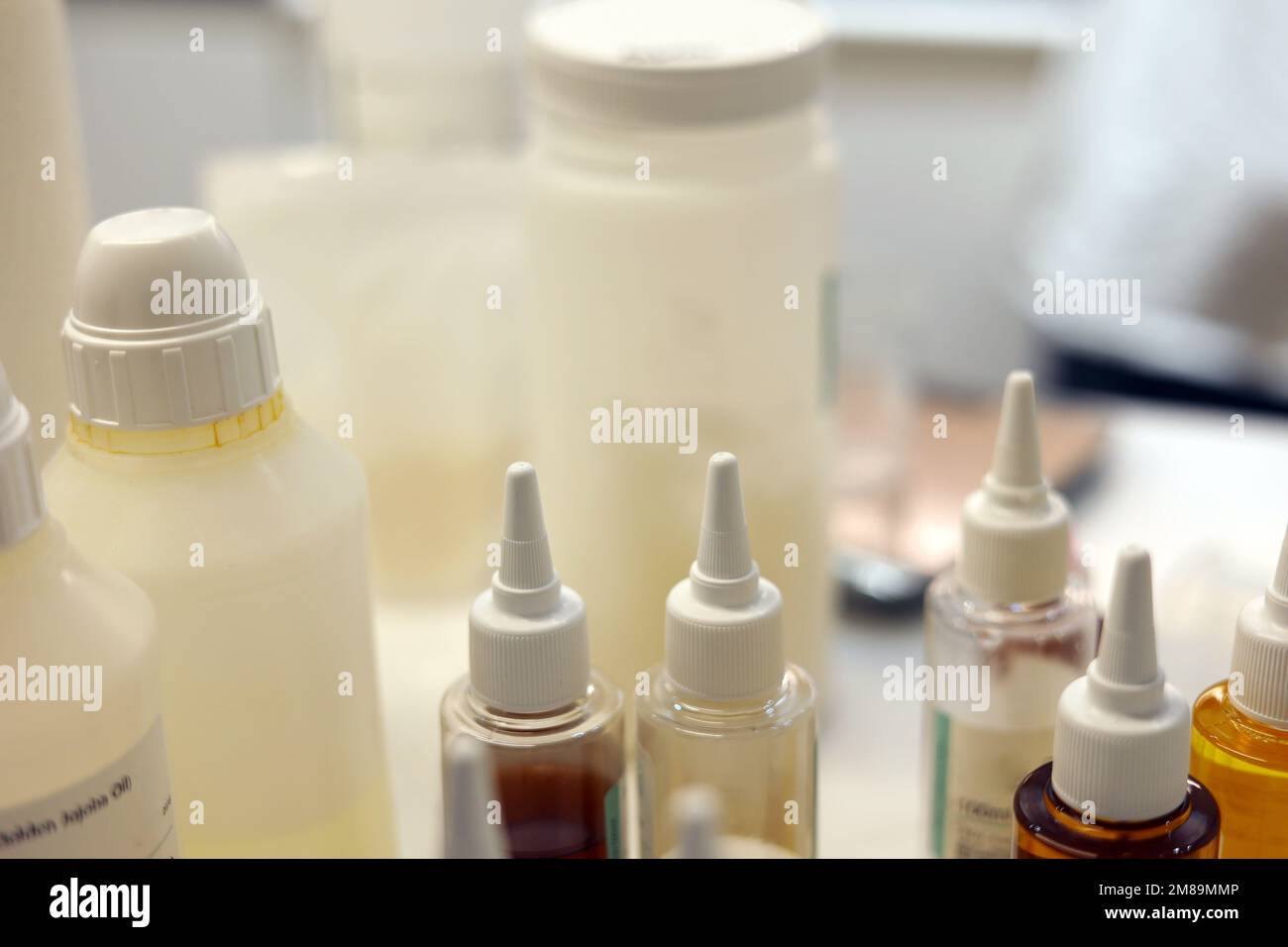 Many kind of liquid bottles in the laboratory Stock Photo - Alamy