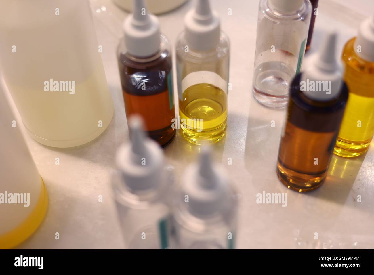 Many kind of liquid bottles in the laboratory Stock Photo - Alamy