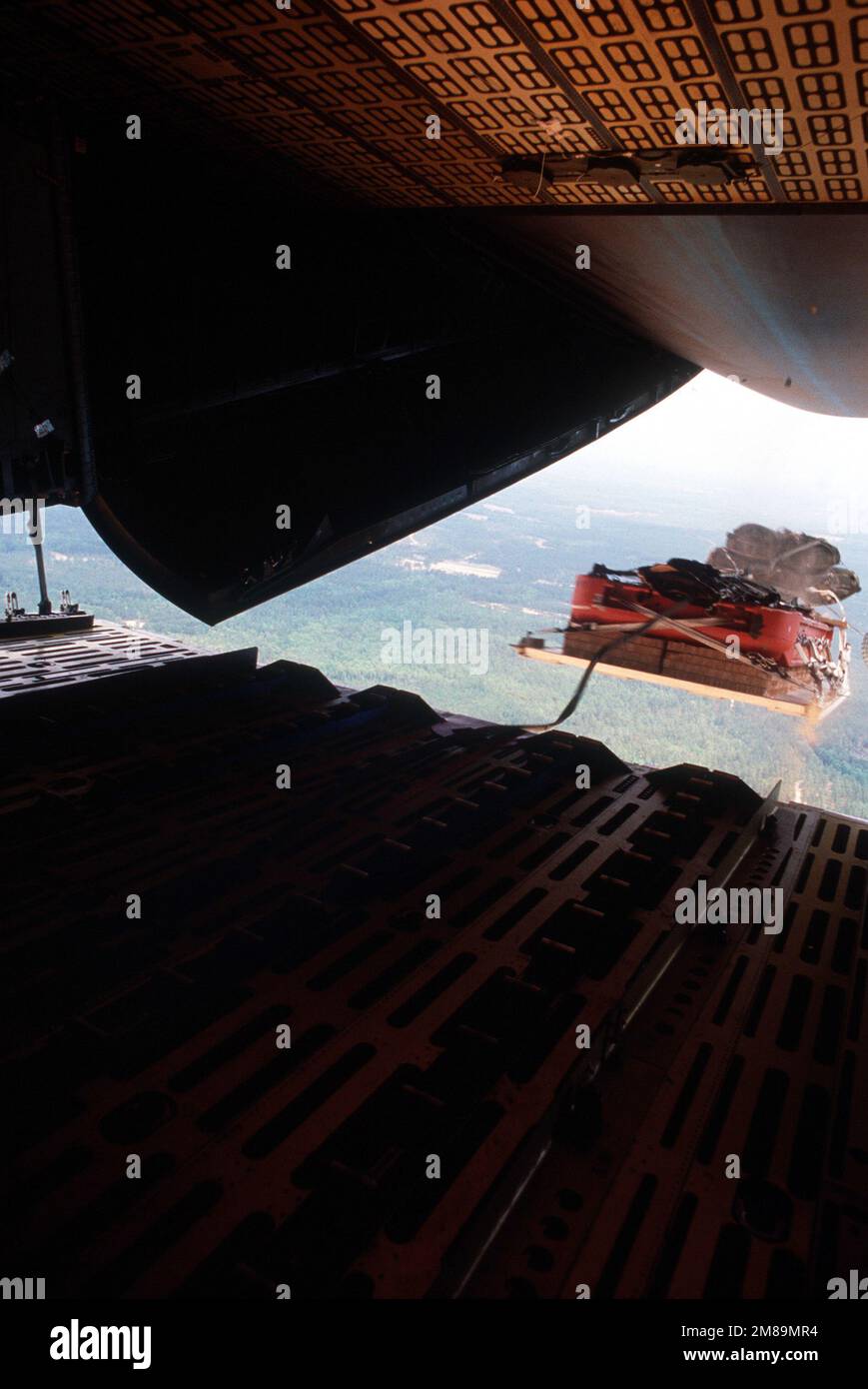 A weighted sled is dropped from the rear of a 436th Military Airlift ...