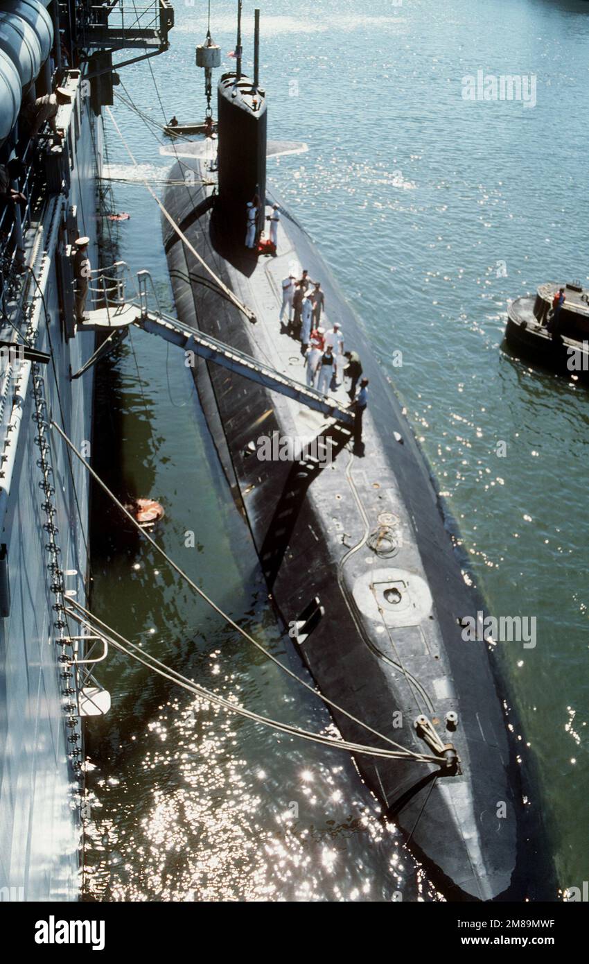 Mooring lines secure the attack submarine USS BONEFISH (SS-582) to the ...