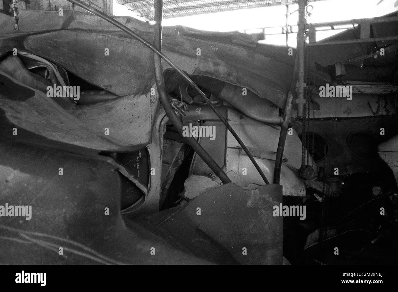 A close-up view of the damage to the hull of the guided missile frigate ...