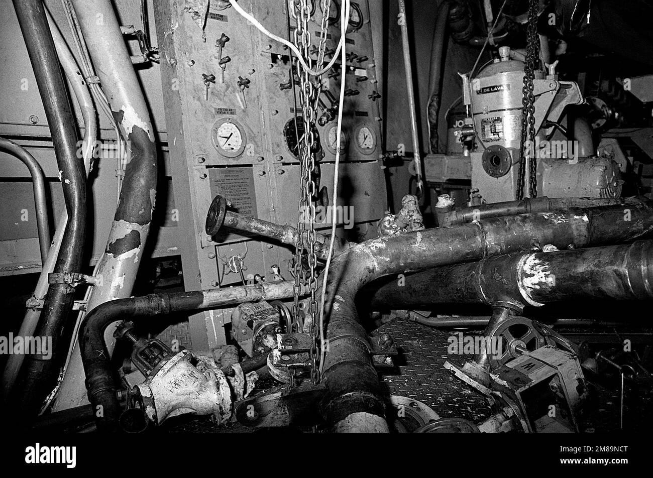 A view of an auxiliary machinery room on the guided missile frigate USS ...