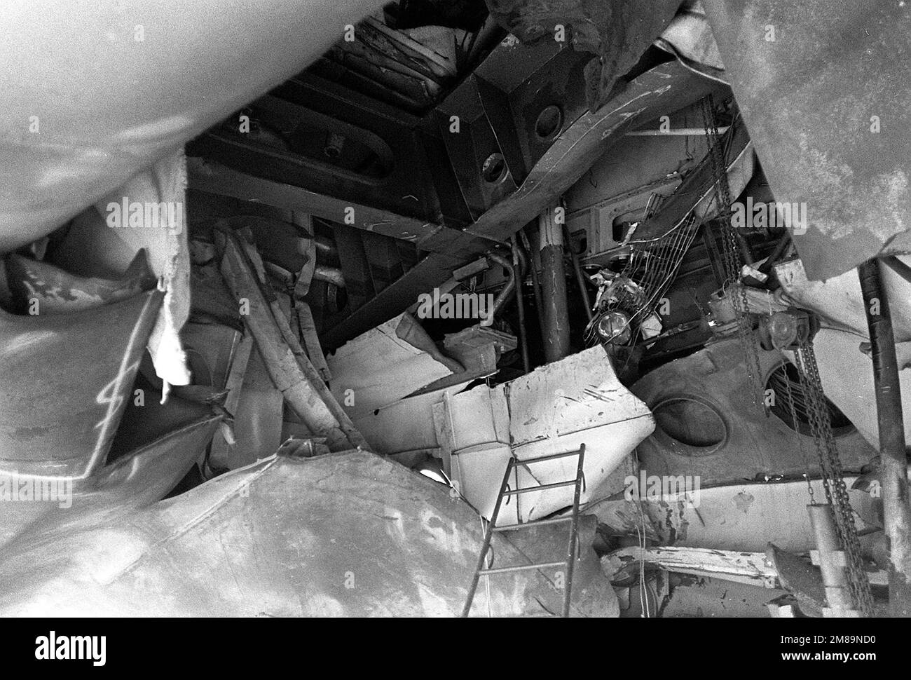 A view looking through the hole in the hull of the guided missile ...