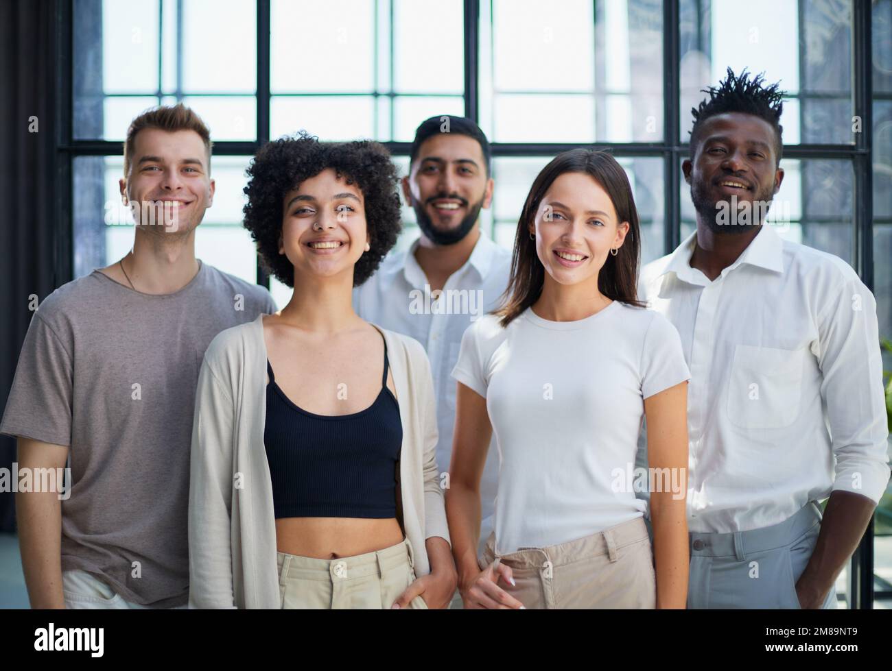 Smiling professional business leaders and employees group team portrait ...