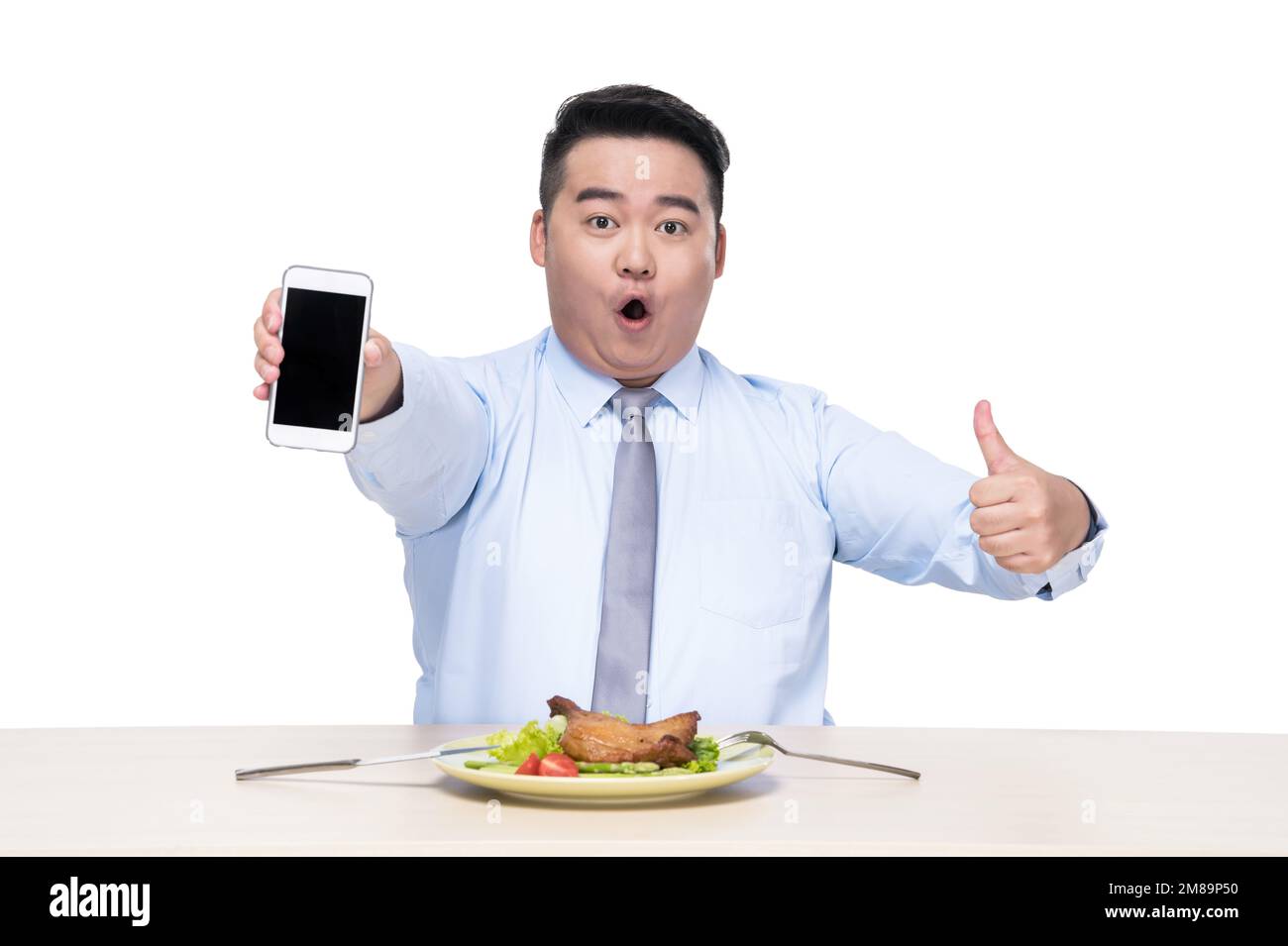 Fat people eat in with mobile phone Stock Photo - Alamy