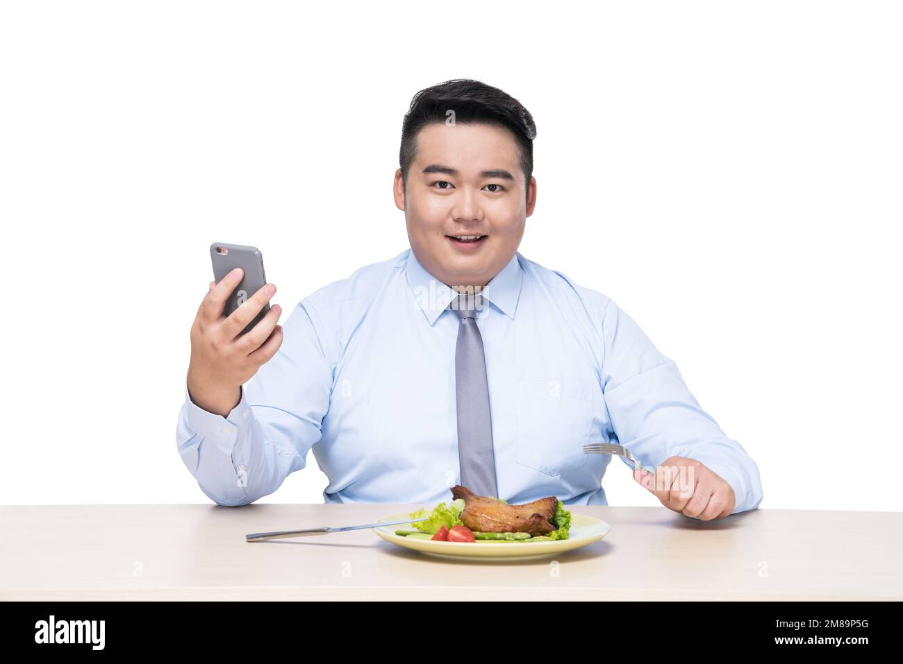 Fat people eat in with mobile phone Stock Photo - Alamy