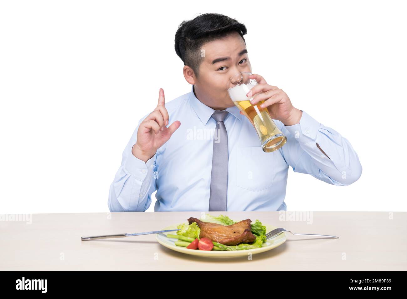 Fat man drinking beer at dinner Stock Photo - Alamy