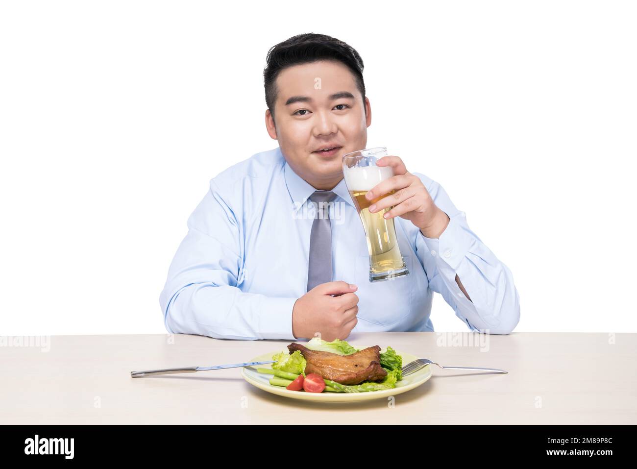 Fat man drinking beer at dinner Stock Photo - Alamy