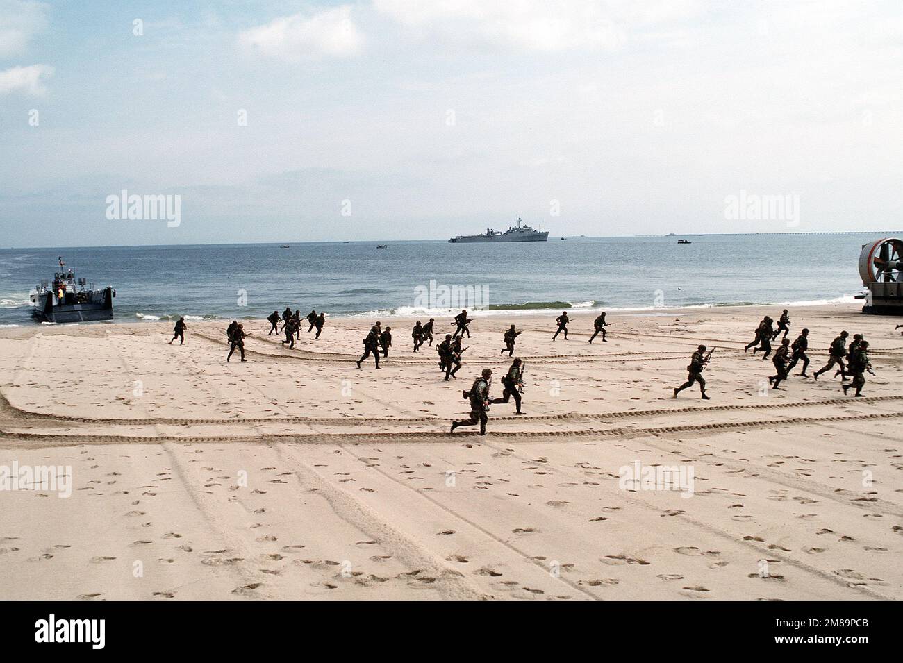 Marines debark an LCM-8 mechanized landing craft during an amphibious ...